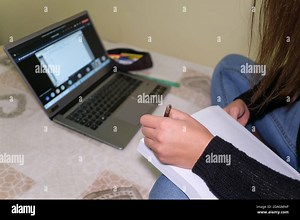 Left handed woman studying on smart school video call,covid-19 pandemic disease Stock Photo - Alamy
